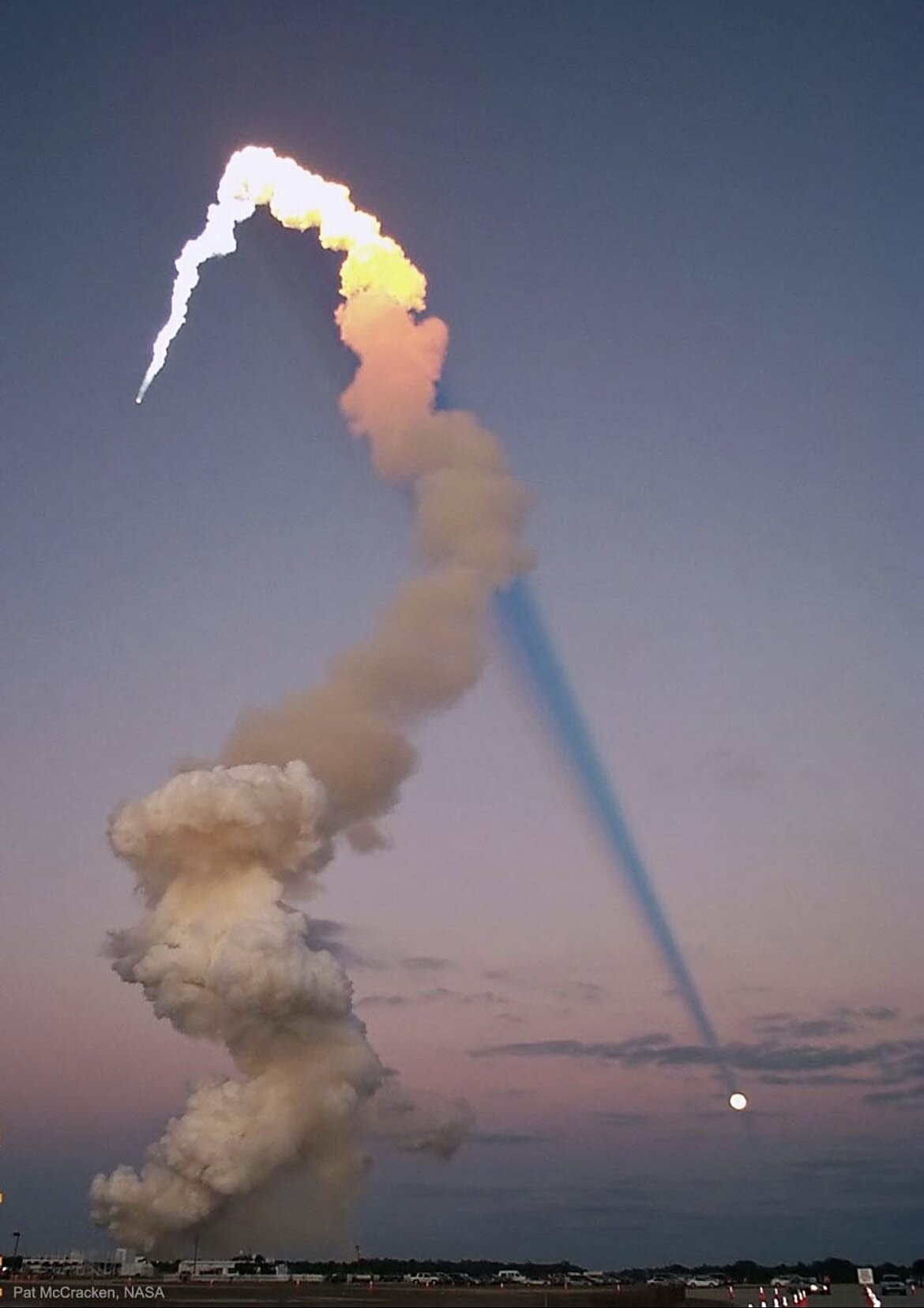 Hava picture of a NASA rocket being launched into the sunset with a ...