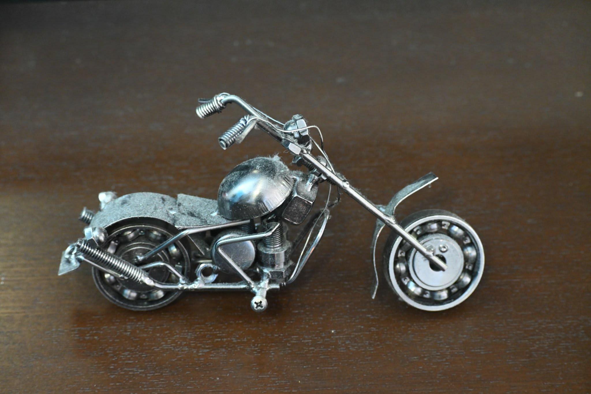 Tiny motorcycle Nikon Zfc ISO 3200 111mm F 4.8 Shutter speed - 1/10 s ...